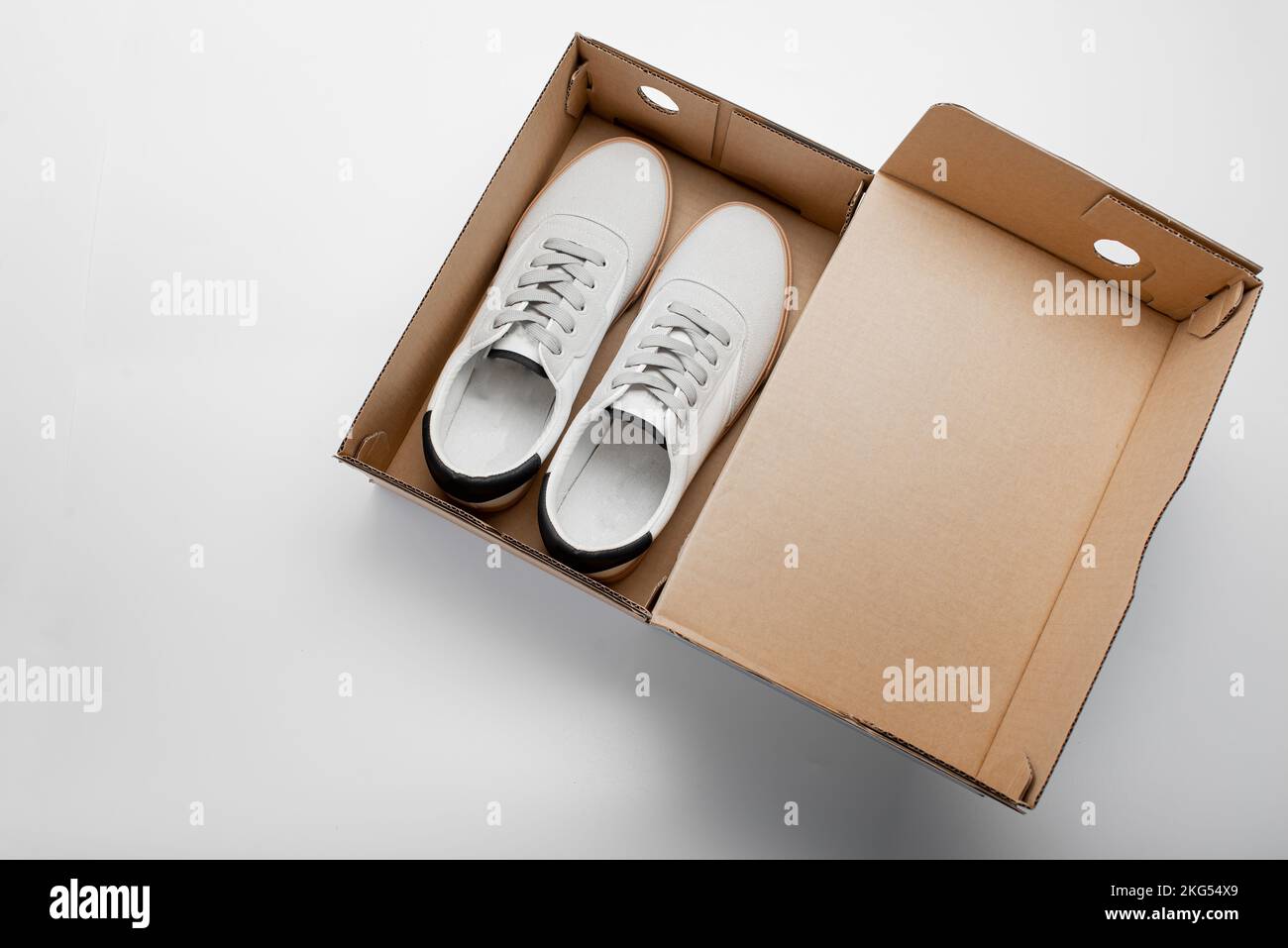 shoes in a cardboard box. Casual white sneakers Stock Photo - Alamy