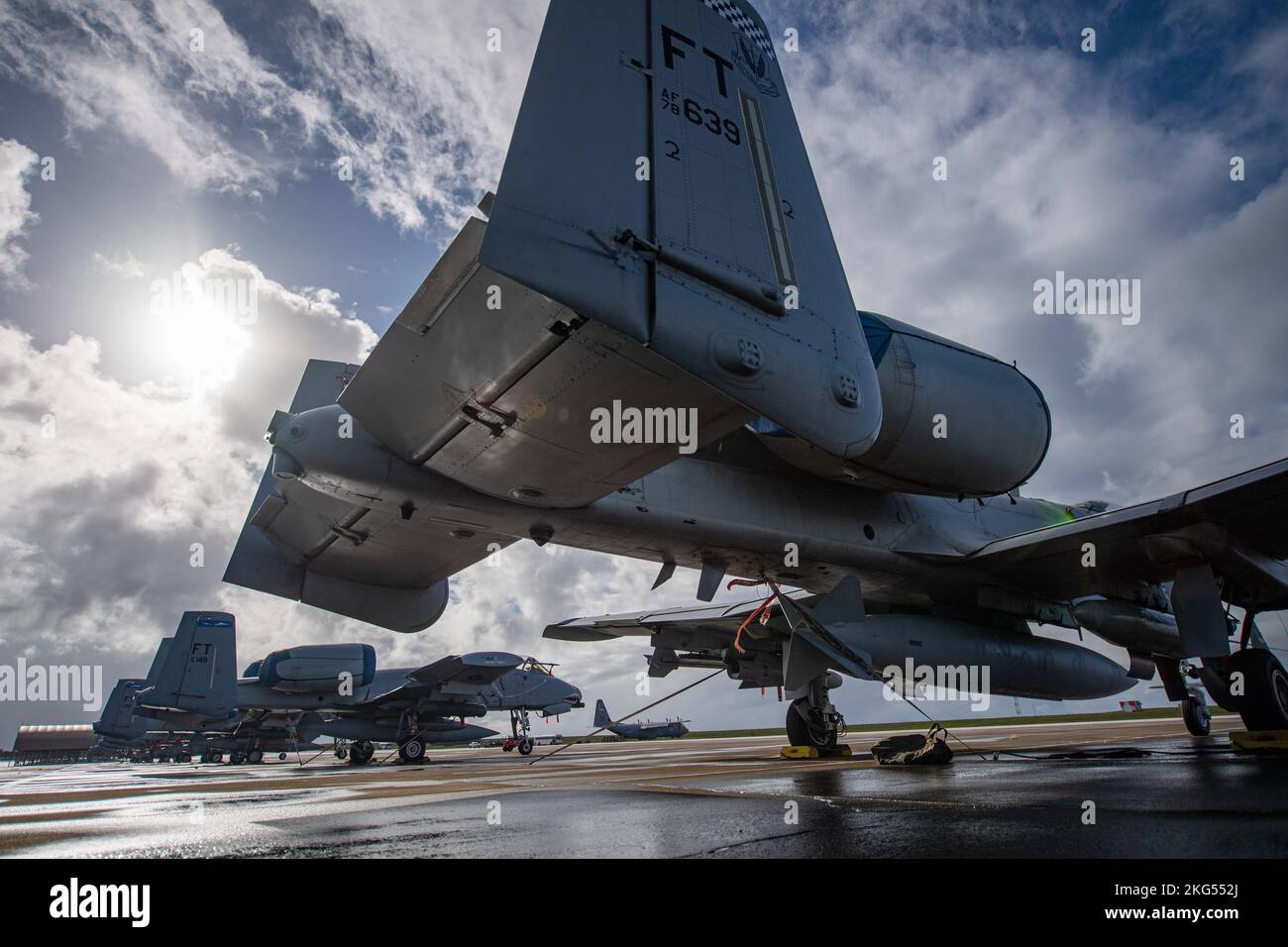 A row of A-10C Thunderbolt II aircraft sit on the flightline at ...