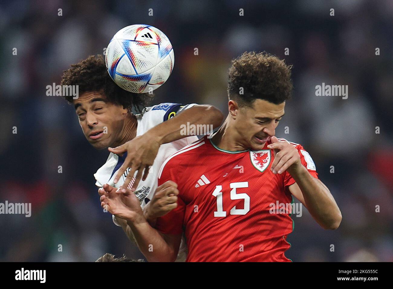 Al Rayyan, Qatar. 21st Nov, 2022. Ethan Ampadu (R) of Wales heads the ...