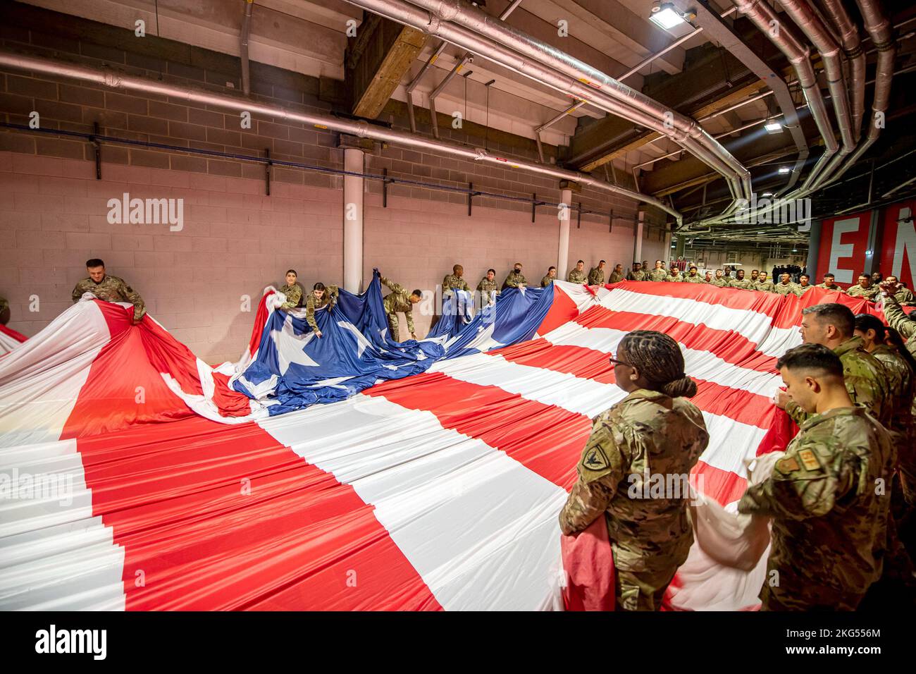 Airmen from the 501st Combat Support Wing, fold an American flag prior ...