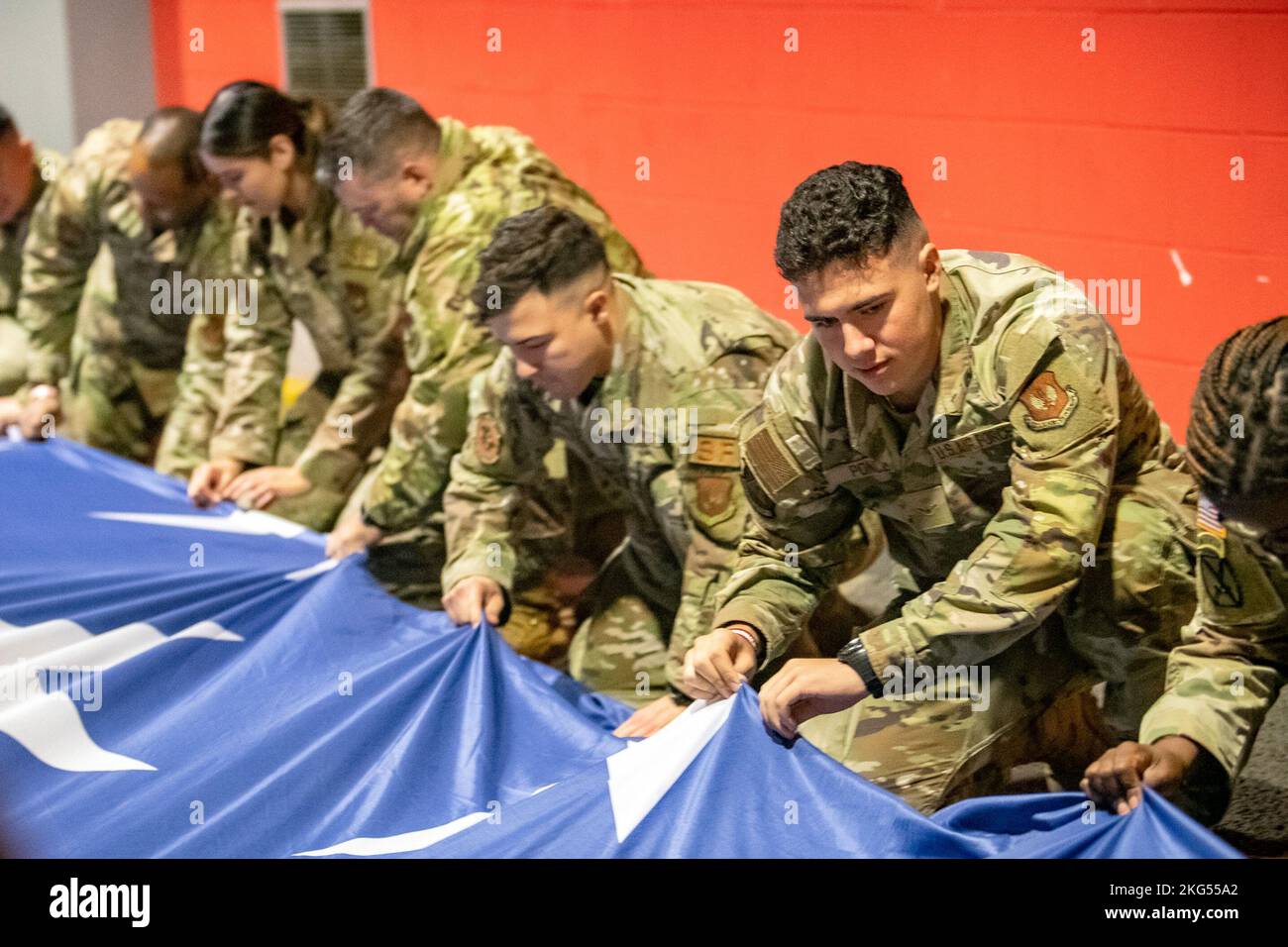 Airmen from the 501st Combat Support Wing fold an American flag at ...