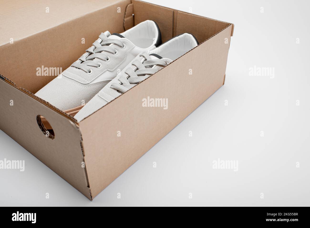 pair of brand casual new shoes in shoe cartoon box Stock Photo - Alamy