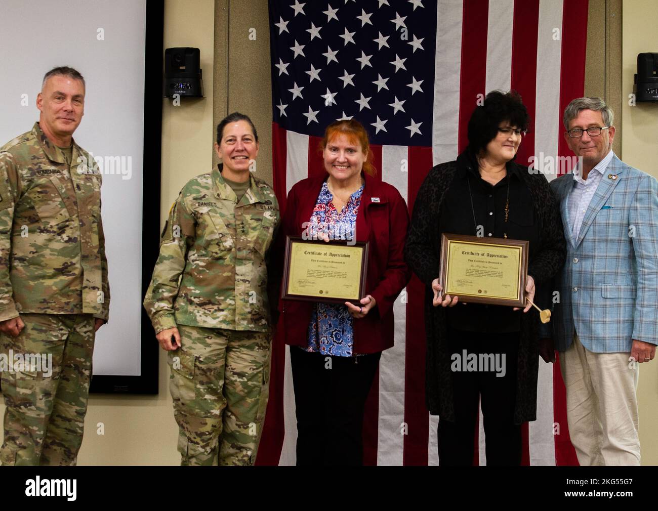 The U.S. Army Reserve Command team, left, and Mr. John McCarthy, right ...
