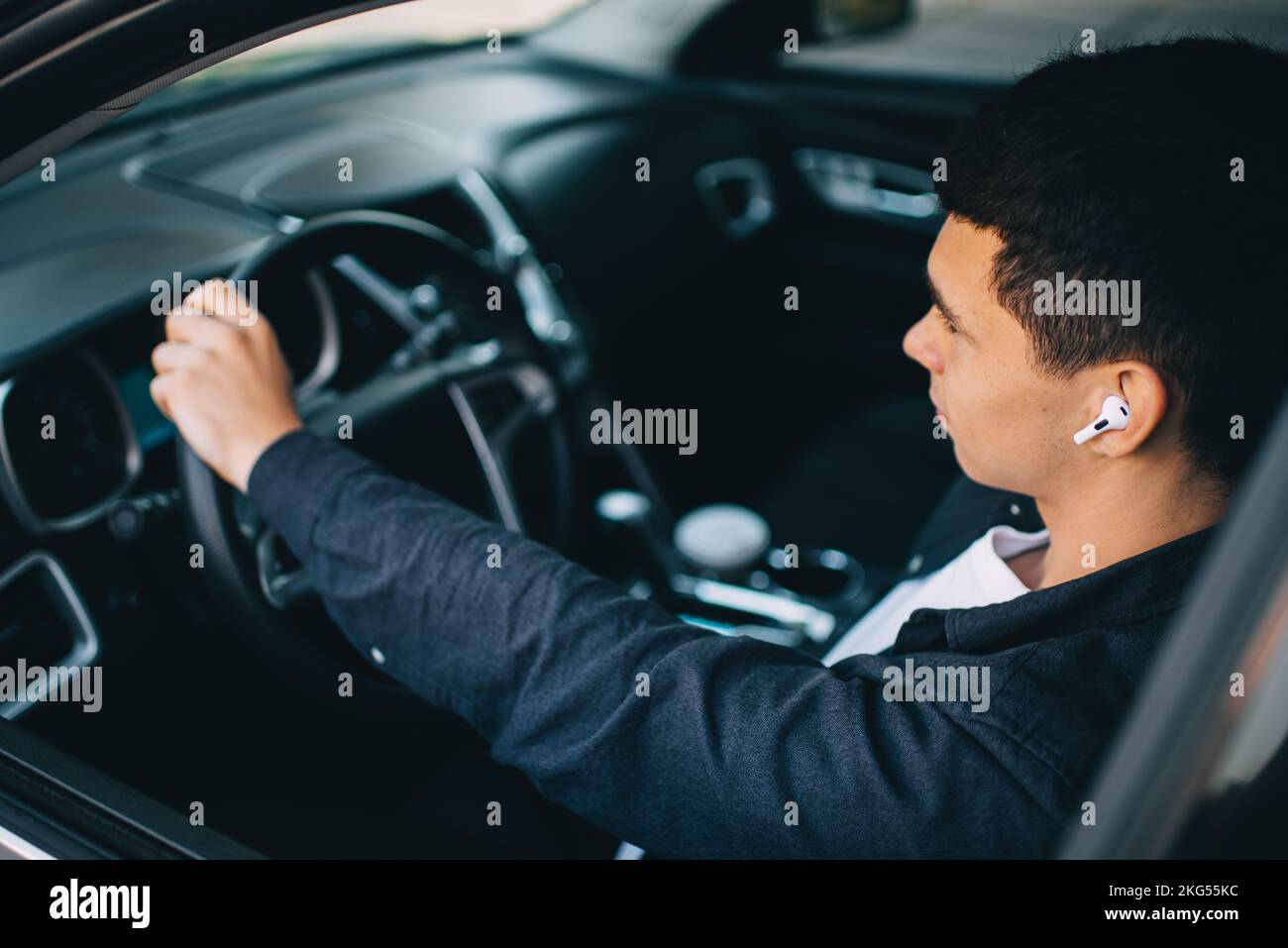 Driving with earphones hi-res stock photography and images - Alamy