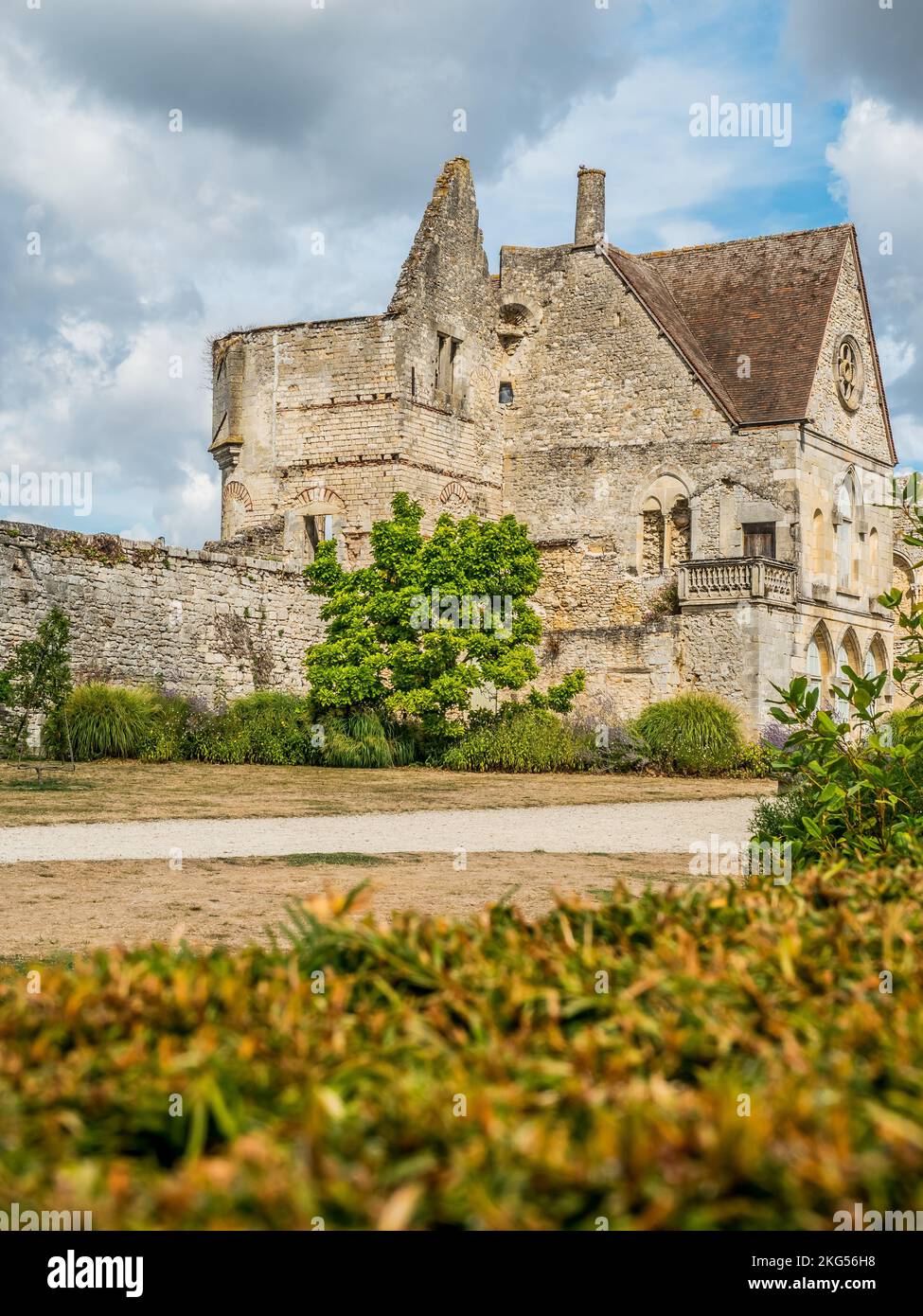 A vertical shot of a historic stone building against a cloudy sky Stock ...