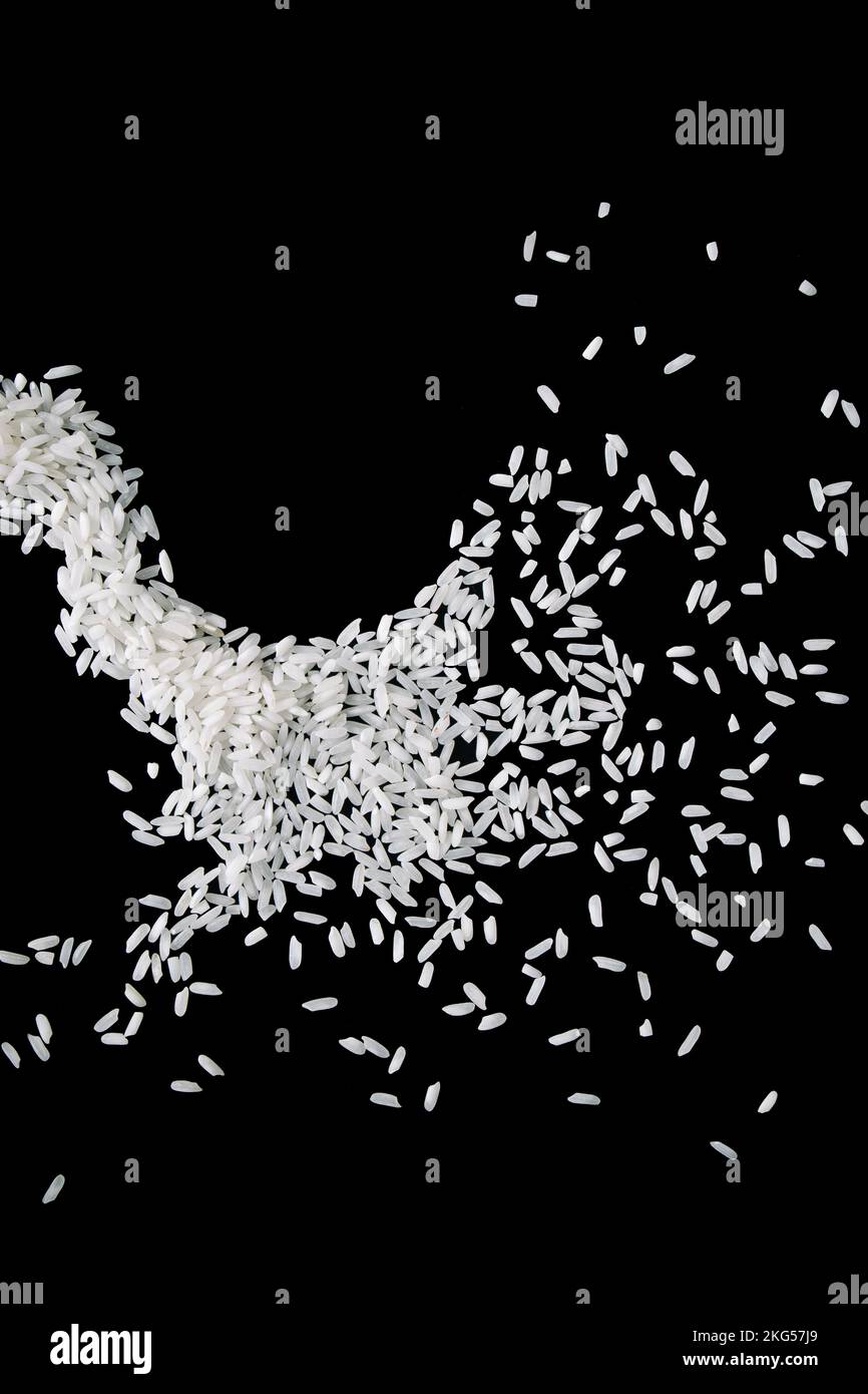 Raw white rice splash on black background. Uncooked rice explosion ...