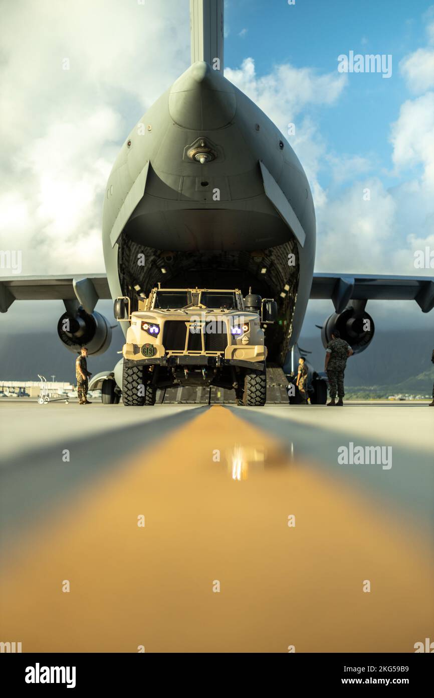 A U.S. Marine Corps Joint Light Tactical Vehicle loads into a U.S. Air ...