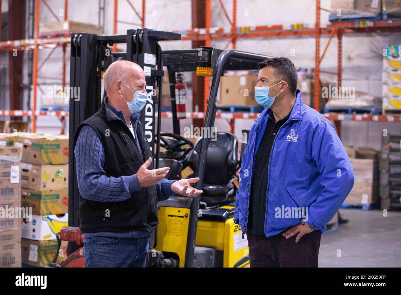 Capt. Simon McKeon, commanding officer, USS Normandy, right, and Nick ...
