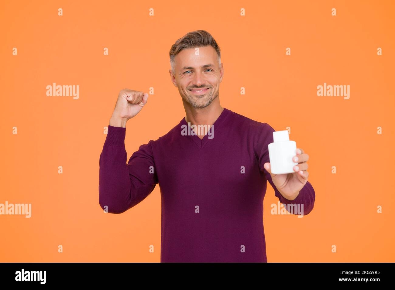 Smell good all day. Happy guy hold cologne bottle. Personal hygiene ...