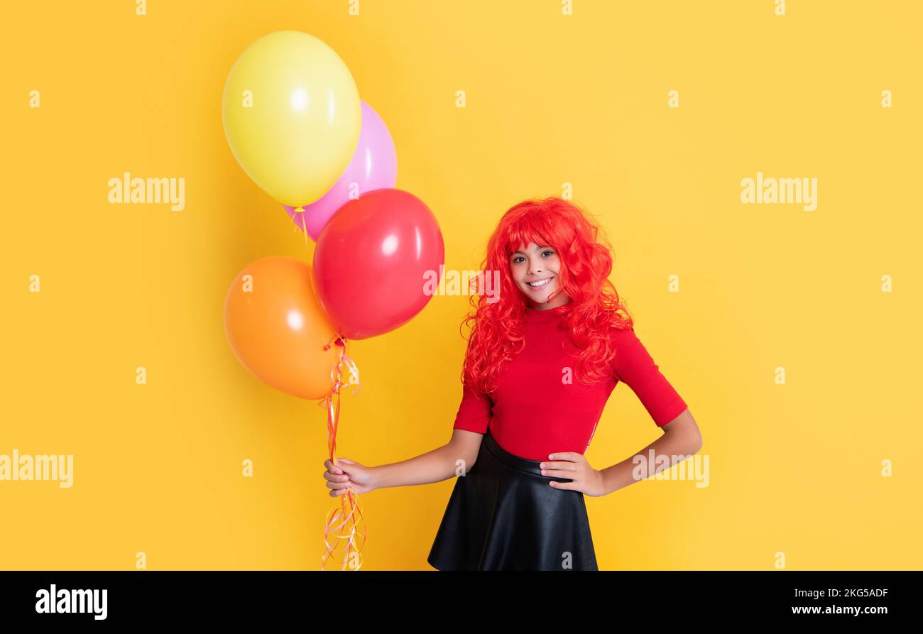 happy child with party balloon on yellow background Stock Photo - Alamy