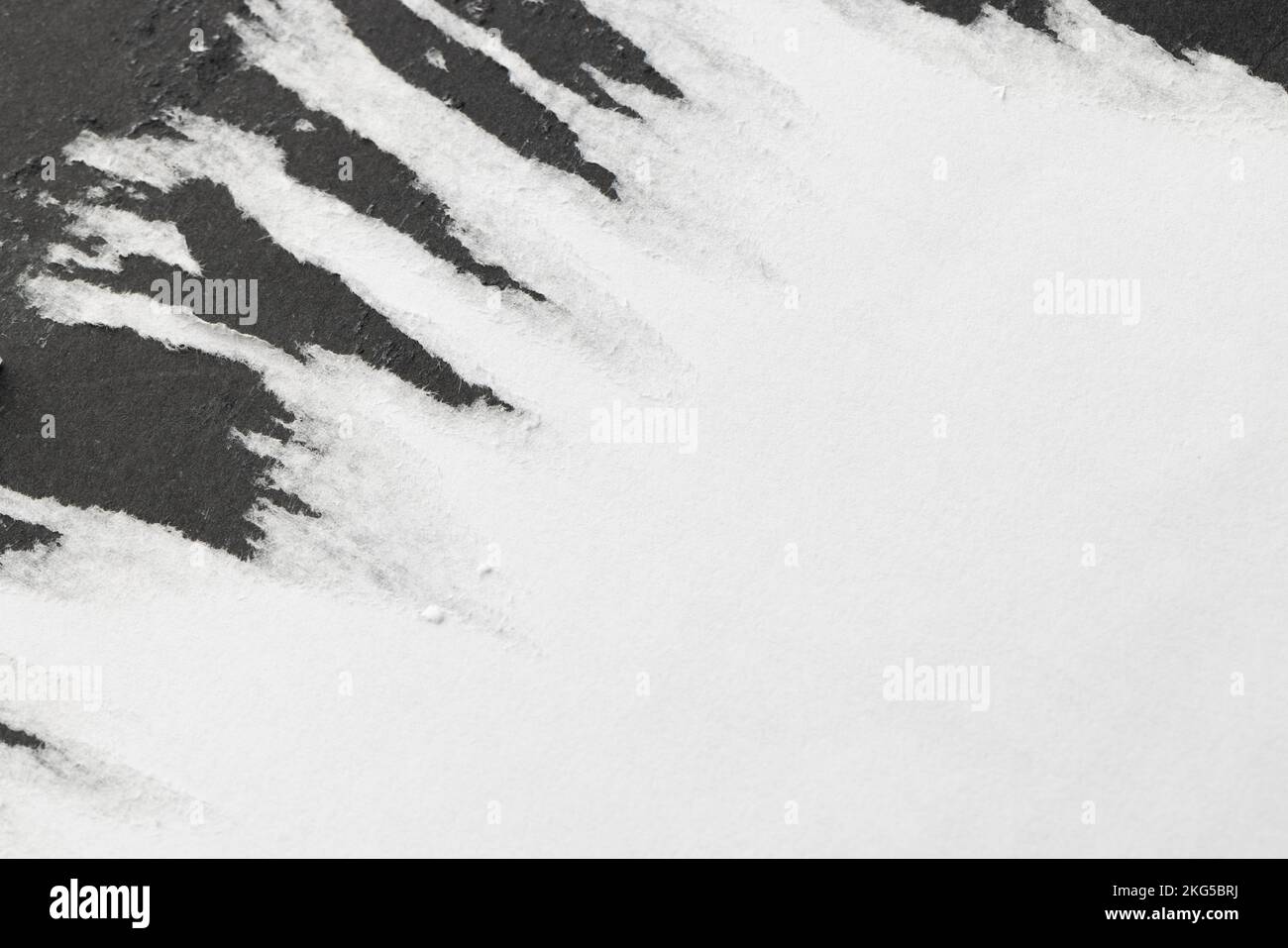 Ripped up pieces of white paper arranged on black background Stock ...