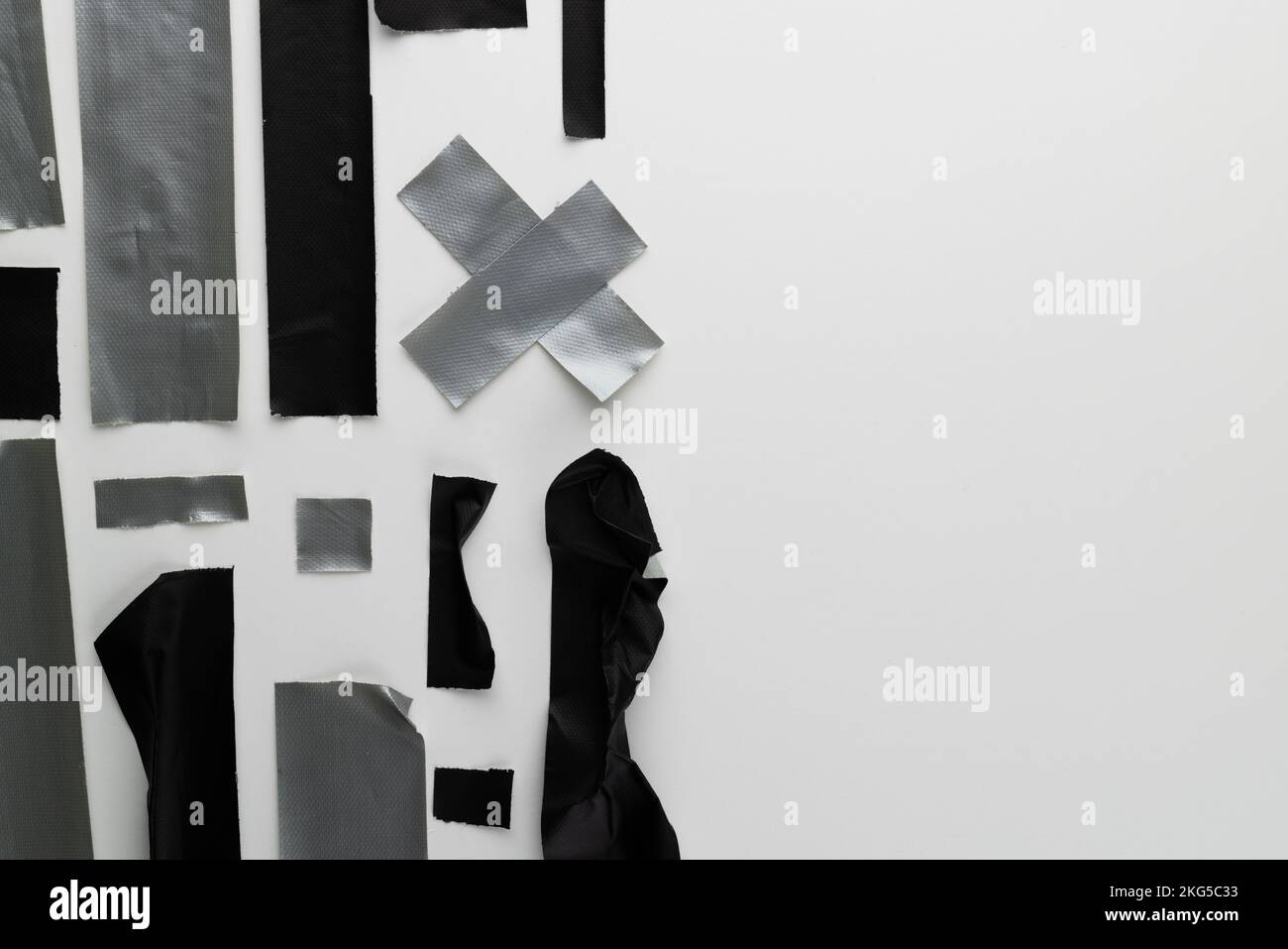 Ripped up pieces of black and silver tape on white background Stock ...