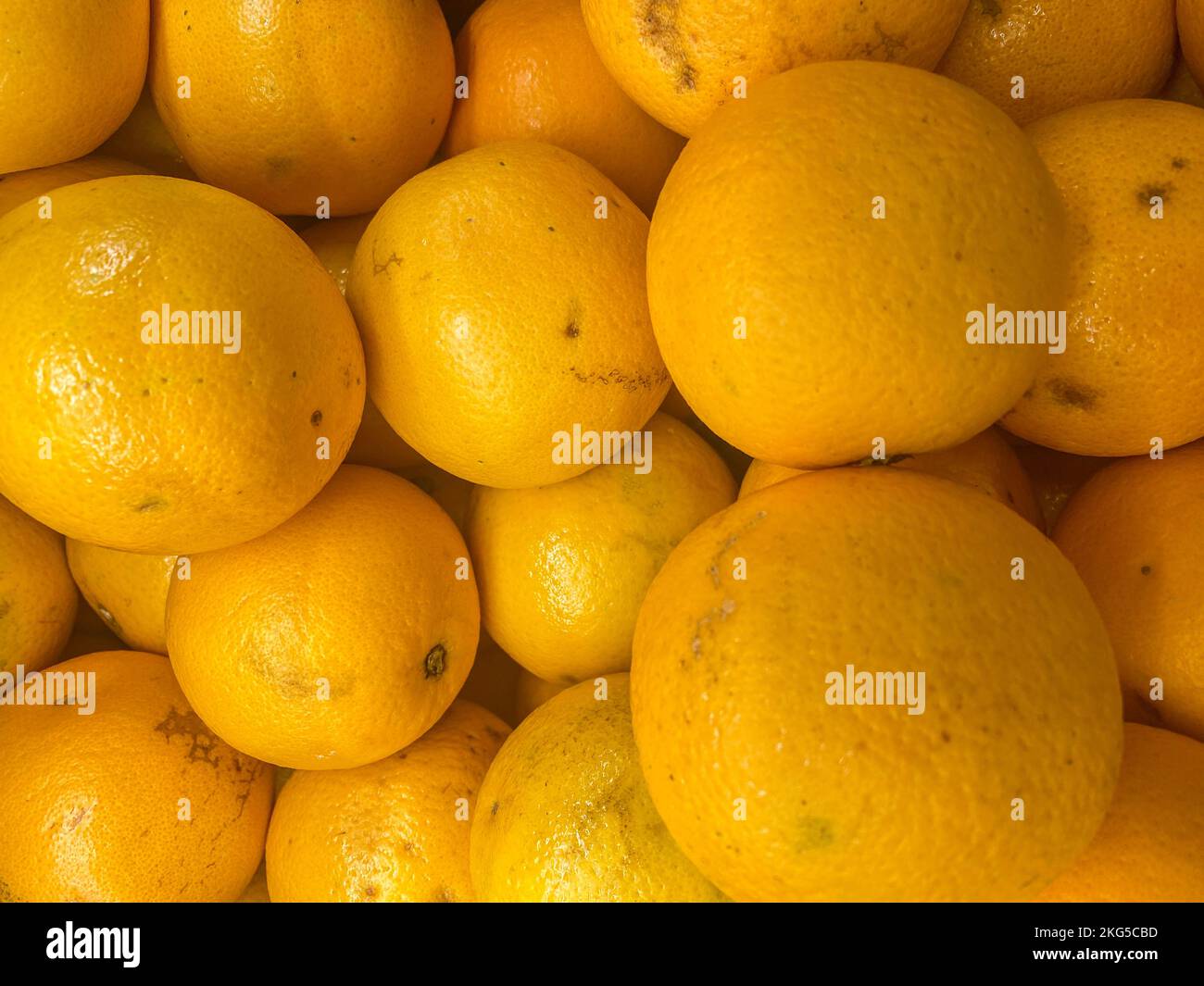 Fresh orange fruits as background, top view of orange on table, organic ...