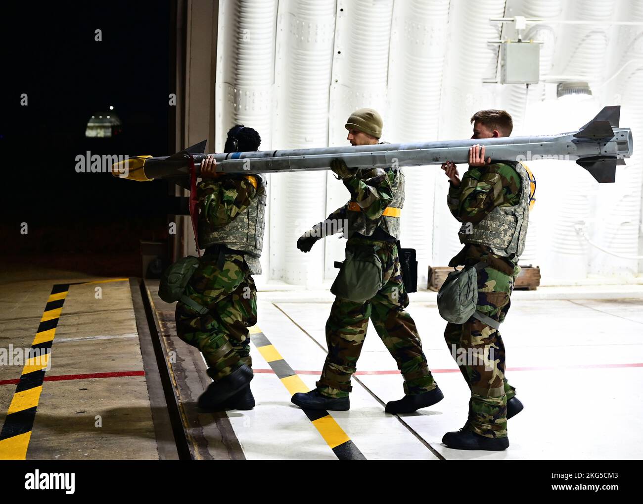 Airmen from the 80th Fighter Generation Squadron move a CATM-9X ...