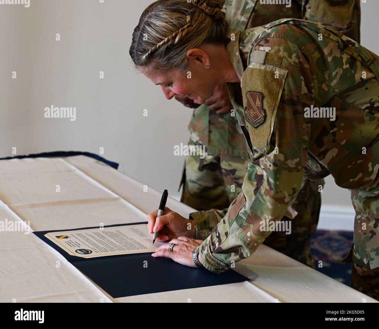 U.S. Air Force Col. Catherine Logan, right, commander of Joint Base ...