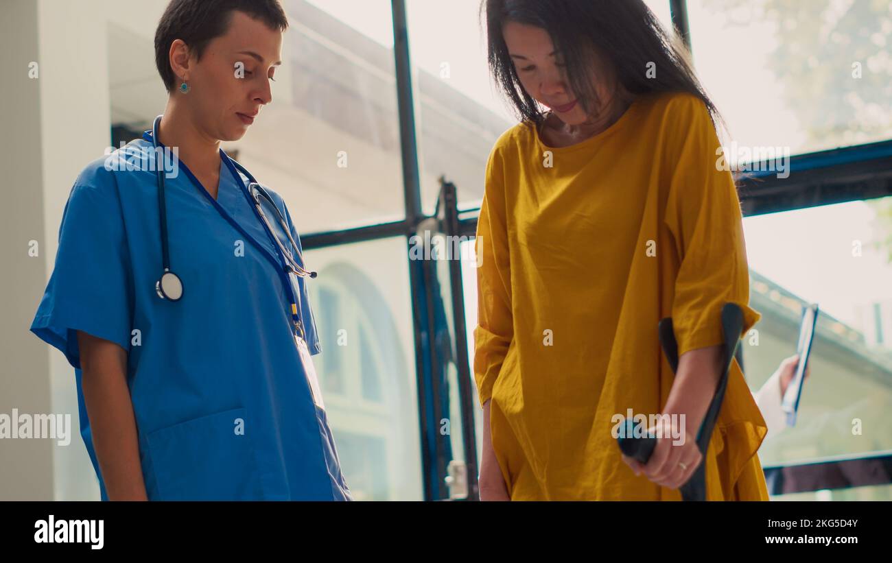 Senior patient trying to walk with walking cane in waiting room at ...