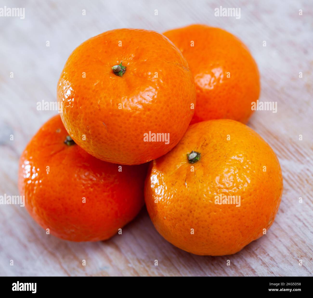 Four fresh clementines Stock Photo - Alamy