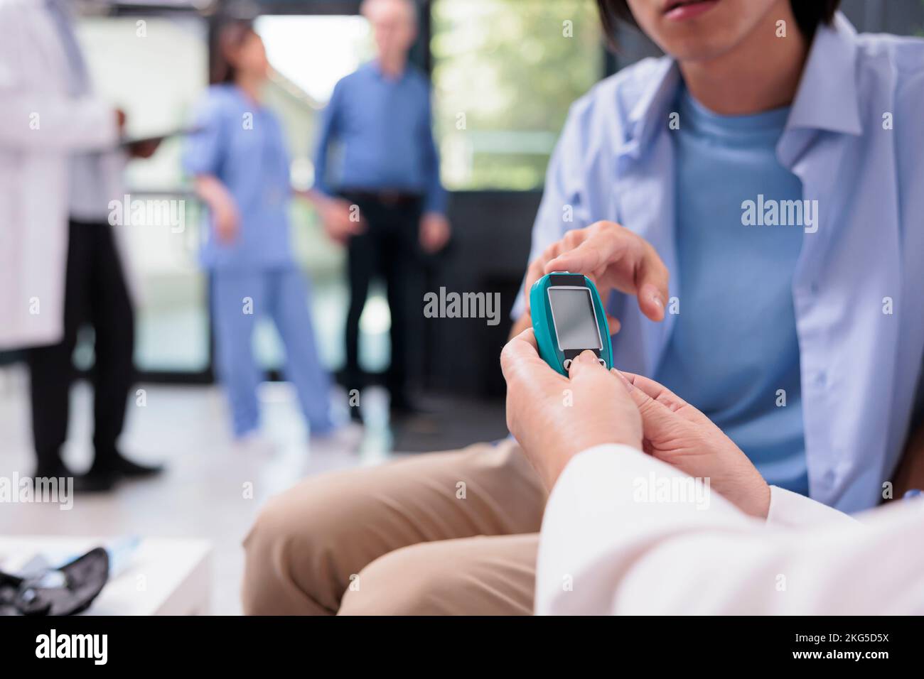 Physician medic measuring sugar level with blood sample to do insulin ...