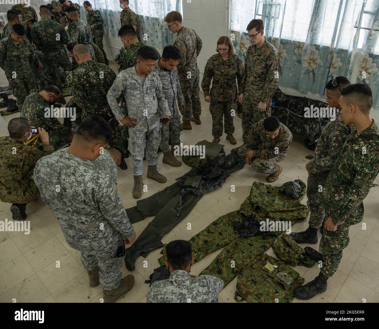 Philippine Marines, Airmen, and U.S. Marines examine mission-oriented ...