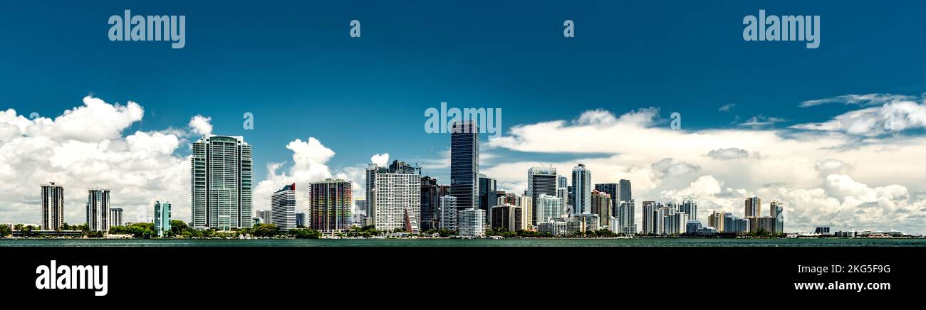 A panoramic of Miami skyline with its skyscrapers against the blue sky ...