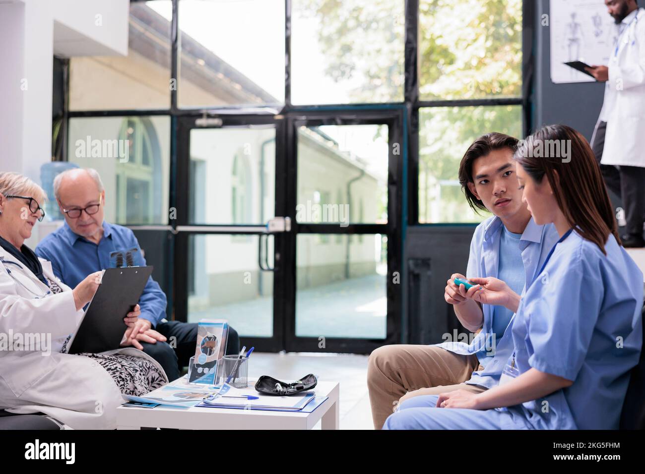 Nurse measuring insulin level and glucose in blood sample using ...