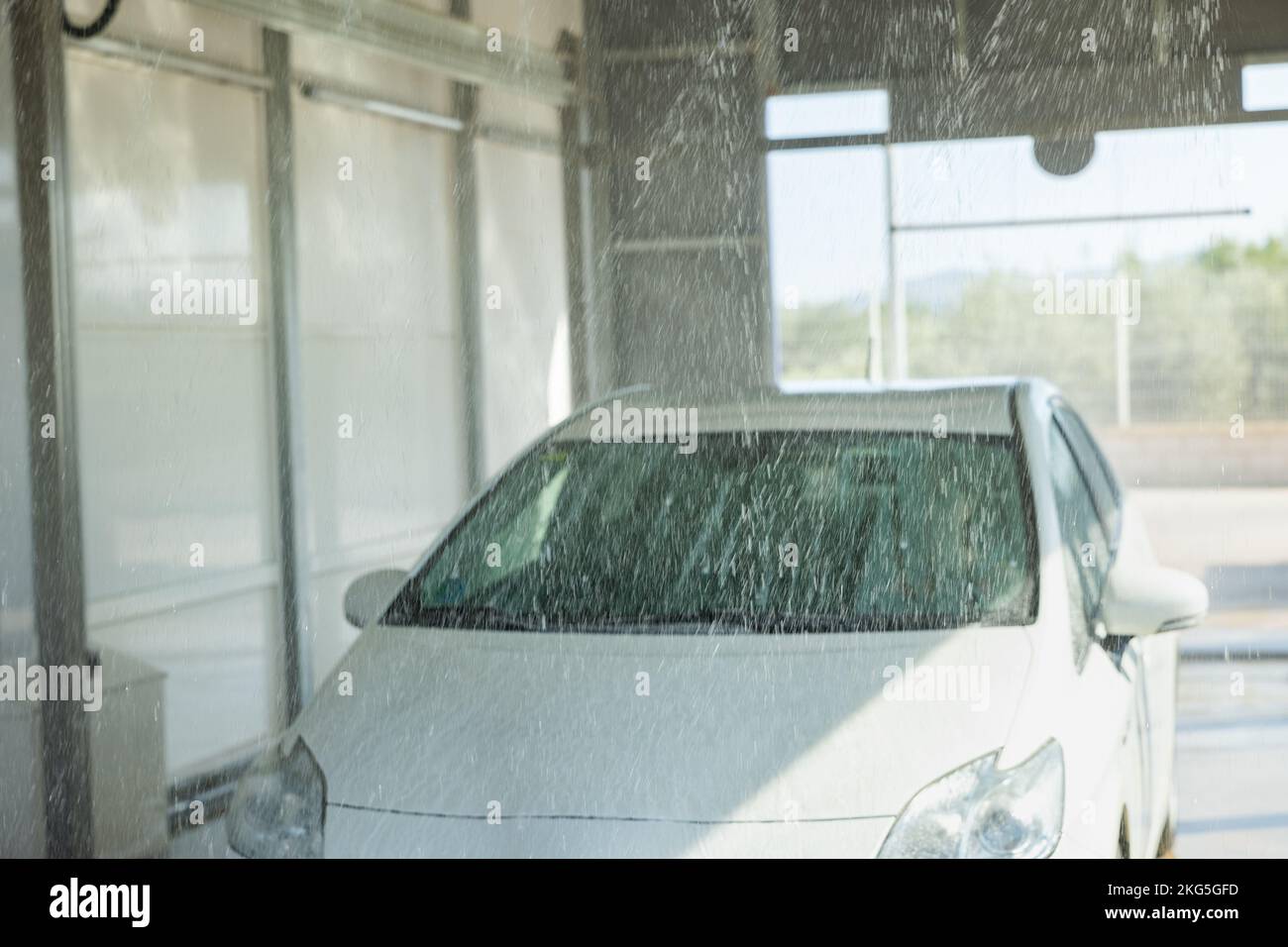 Process of car washing with driver inside Stock Photo - Alamy