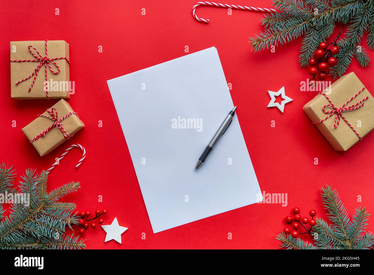 Creative design red background and branches of Christmas trees, gifts ...