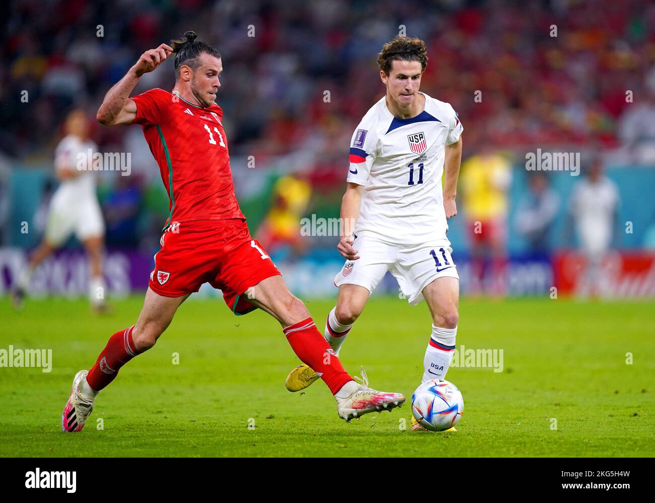 Wales' Gareth Bale (left) and USA's Brenden Aaronson battle for the ...