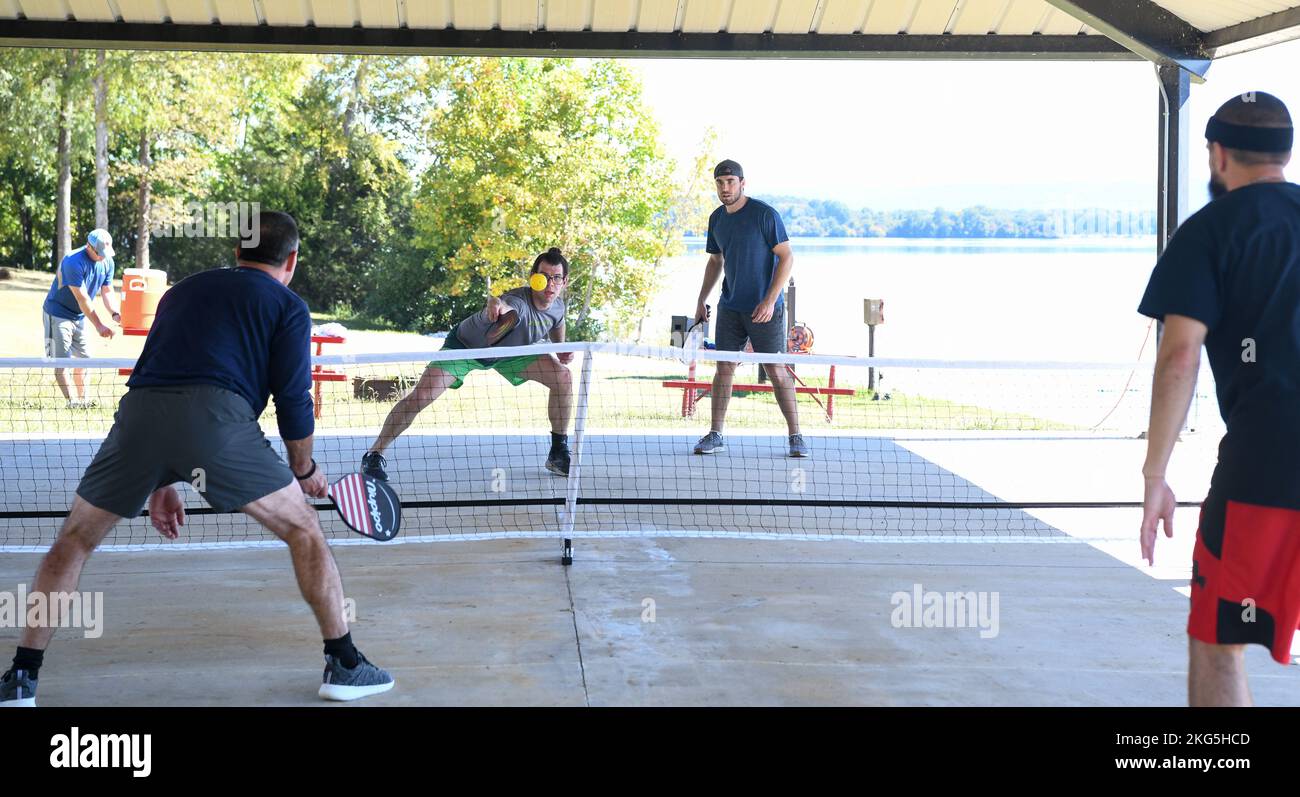 Joseph Bedell, center, representing the 804th Test Group, plays a shot ...