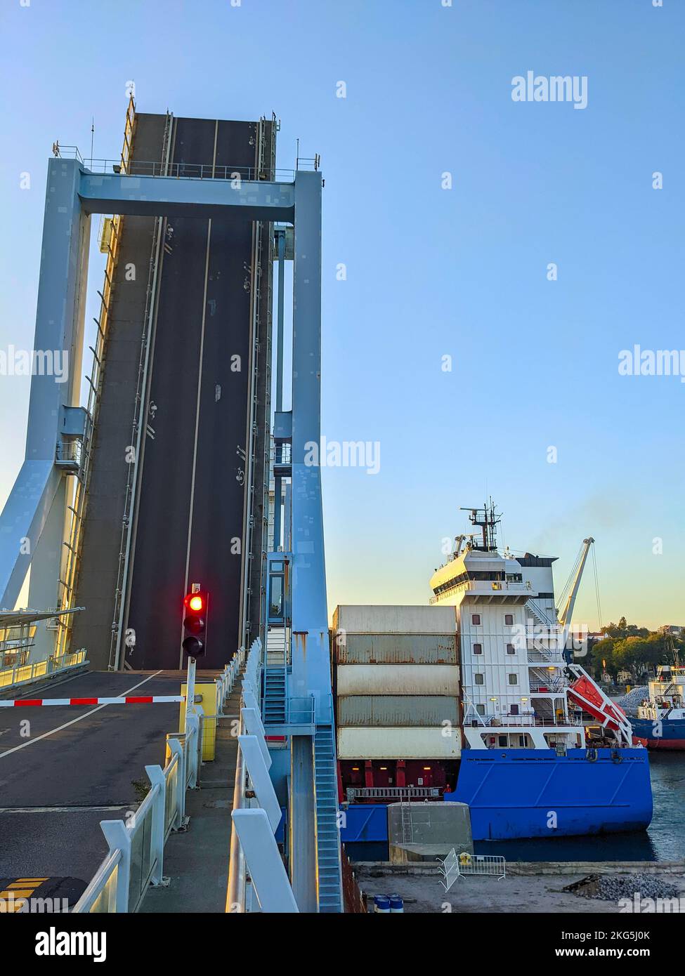 Leixoes port opened drawbridge and ship passing with freight containers ...