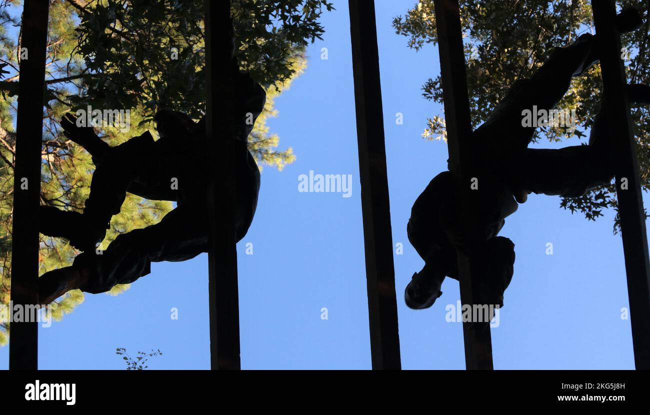 U.S. Soldiers navigate the "Weaver" at the All-American Mile obstacle ...