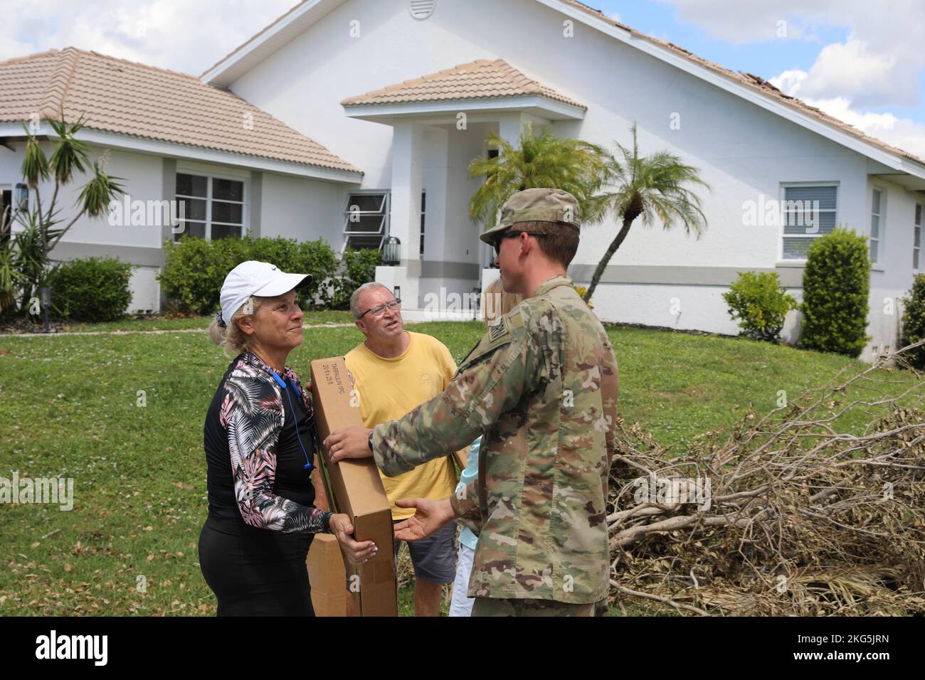 Soldiers with the 1-265th Air Defense Artillery (ADA), deliver aid to ...