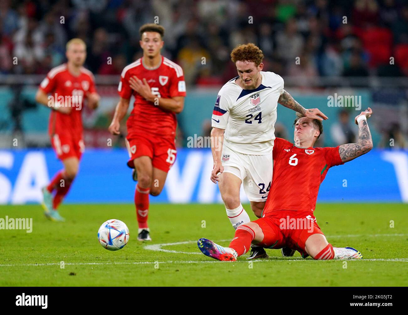 USA's Josh Sargent (centre) and Wales' Joe Rodon battle for the ball ...