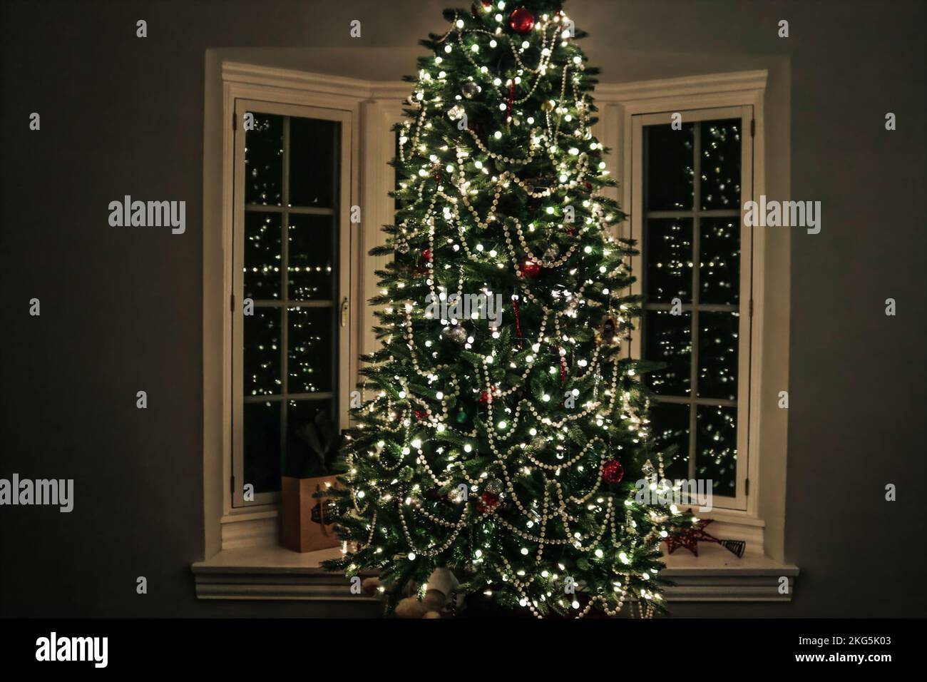Christmas tree reflected in windows hi-res stock photography and images ...