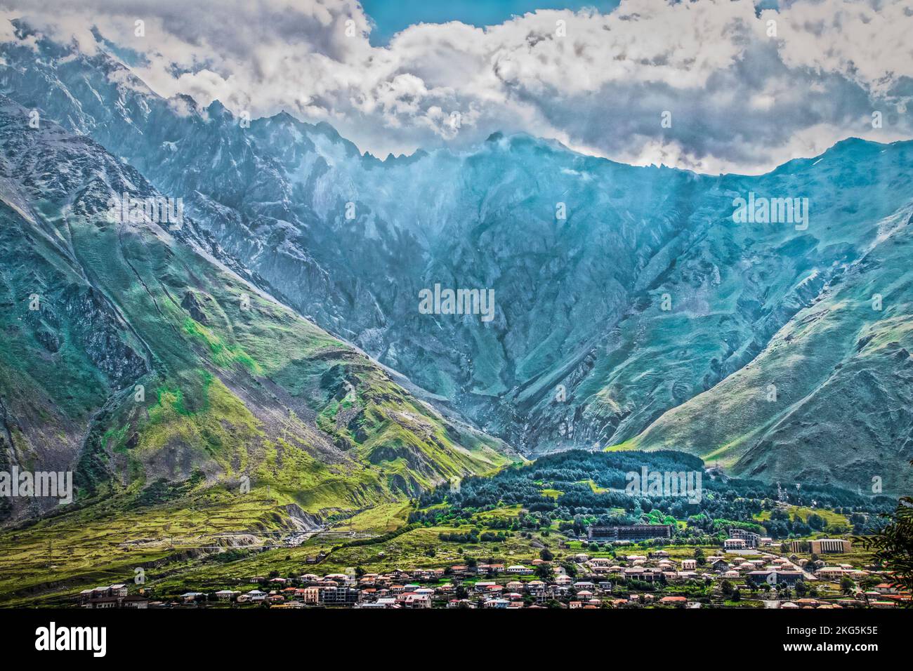 Looking down at over the rooftops of the village of Stepantsminda in ...