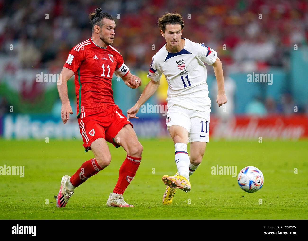 Wales' Gareth Bale (left) and USA's Brenden Aaronson battle for the ...