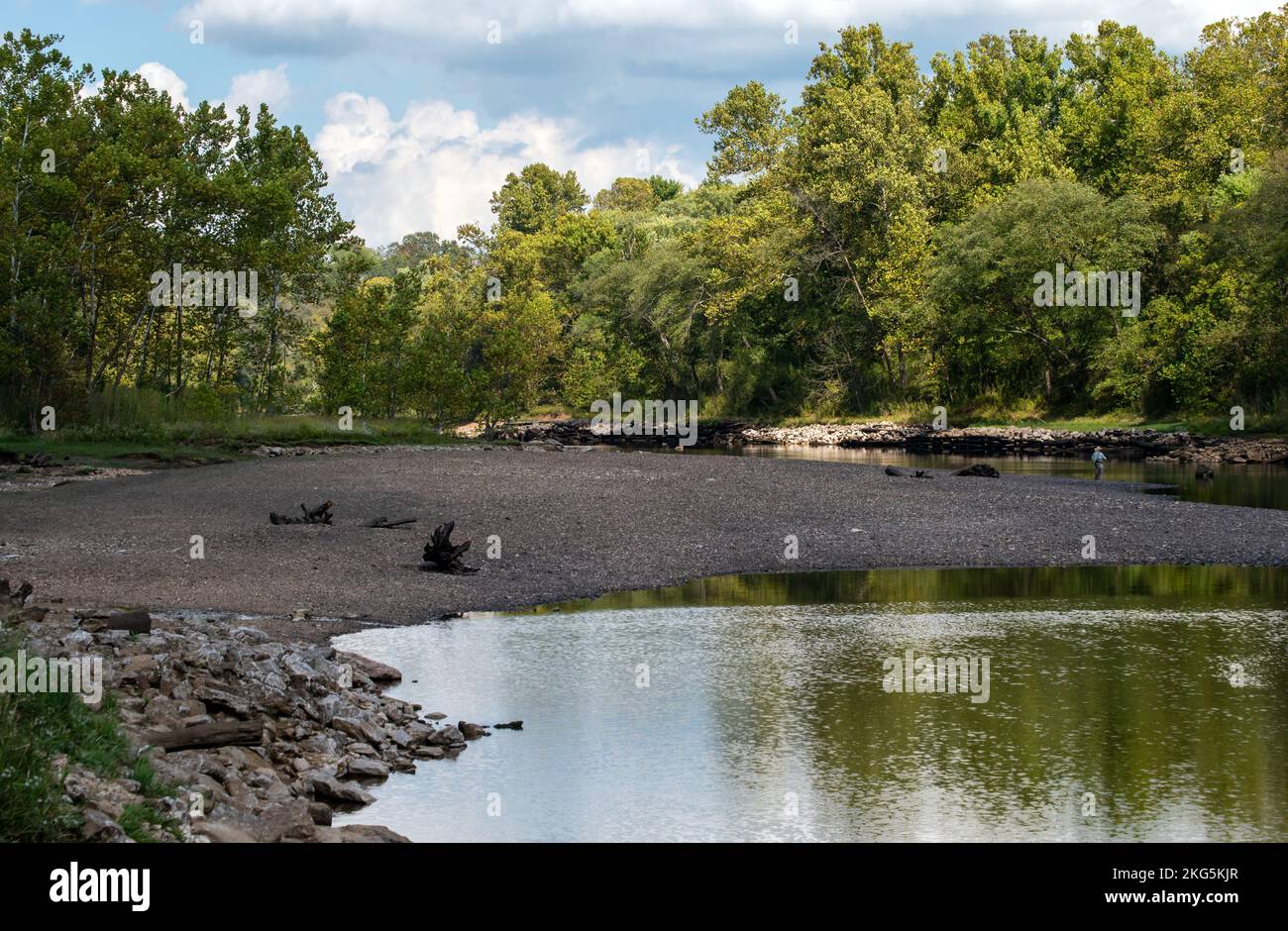 In the distance an unidentified person can be seen fishing along this ...