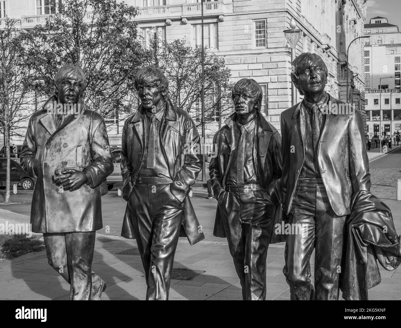 Street scene in Liverpool with the bronze statues of the famous Beatles ...