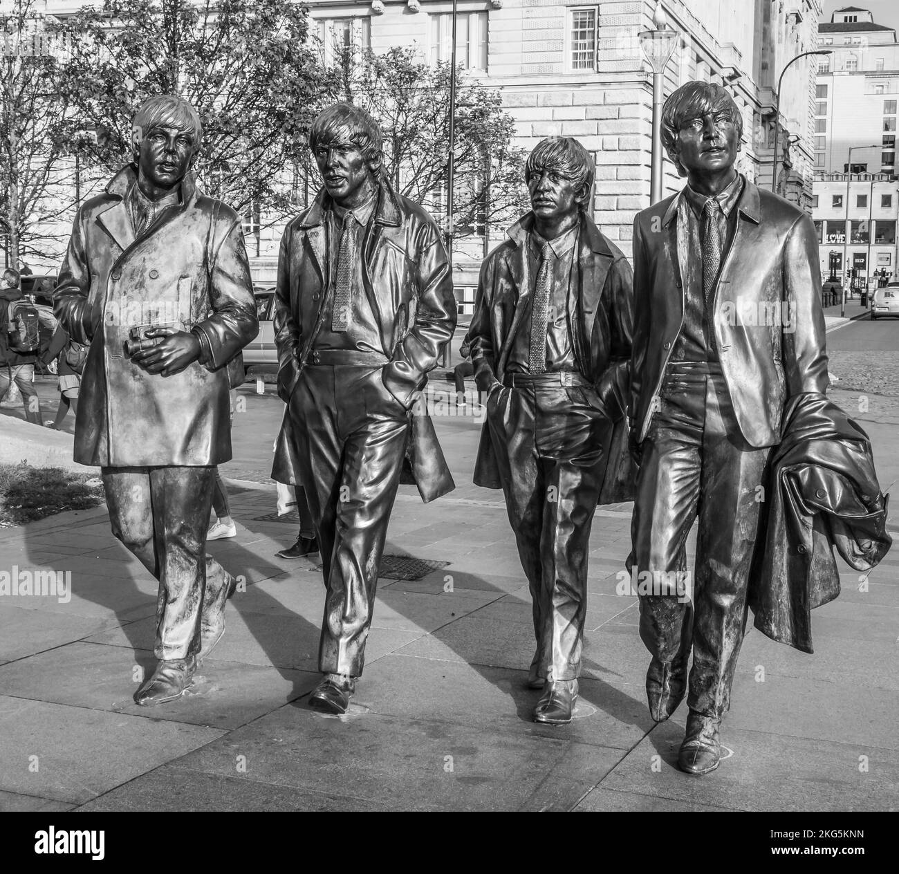 Street scene in Liverpool with the bronze statues of the famous Beatles ...
