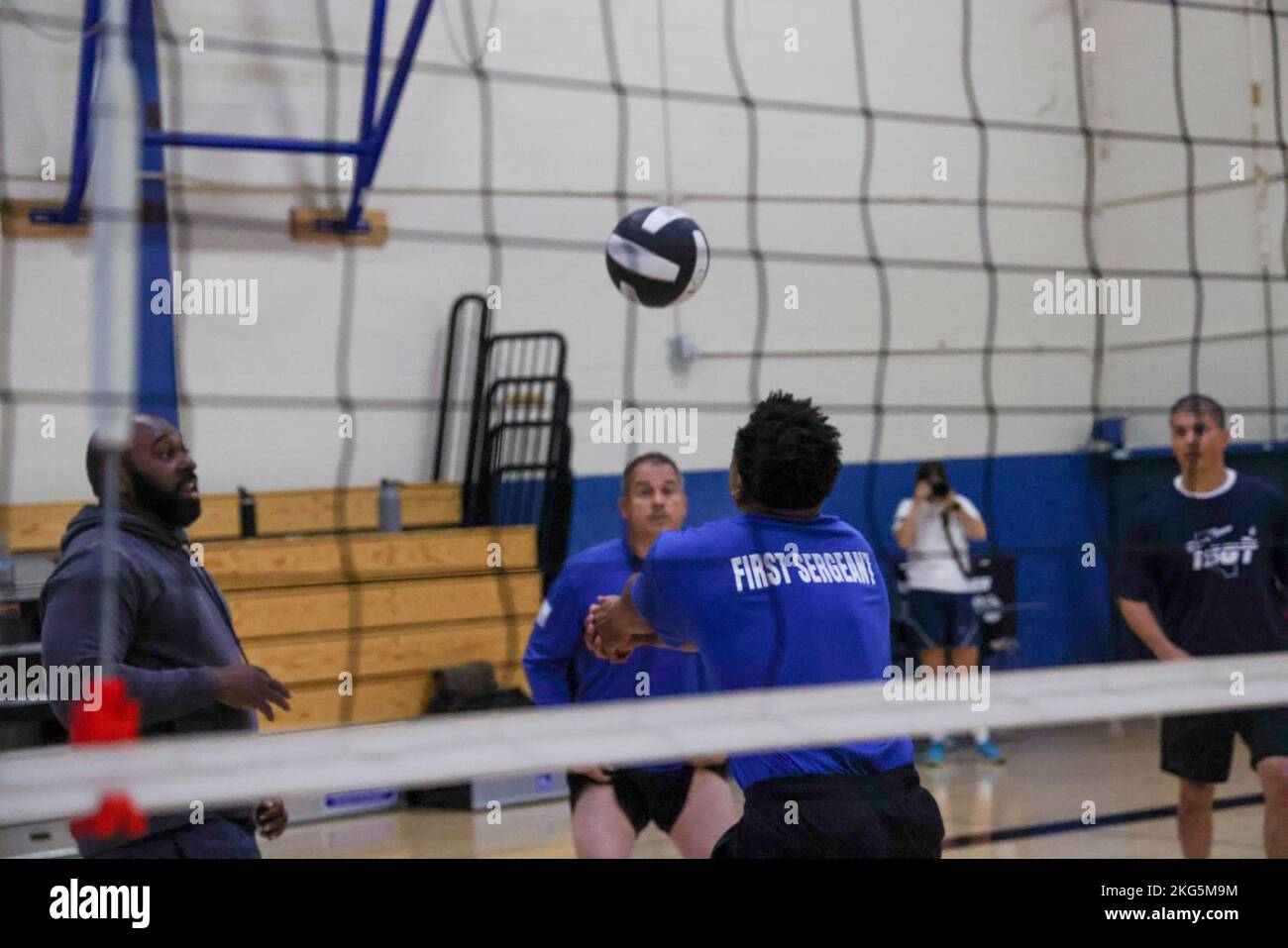 First sergeants and chiefs make a play on the ball during a volleyball ...