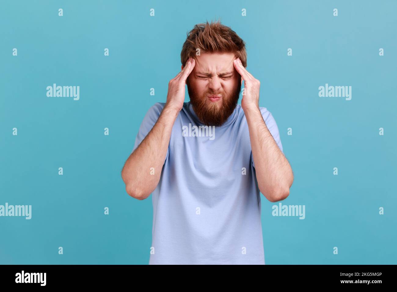 Hands on temples hi-res stock photography and images - Alamy