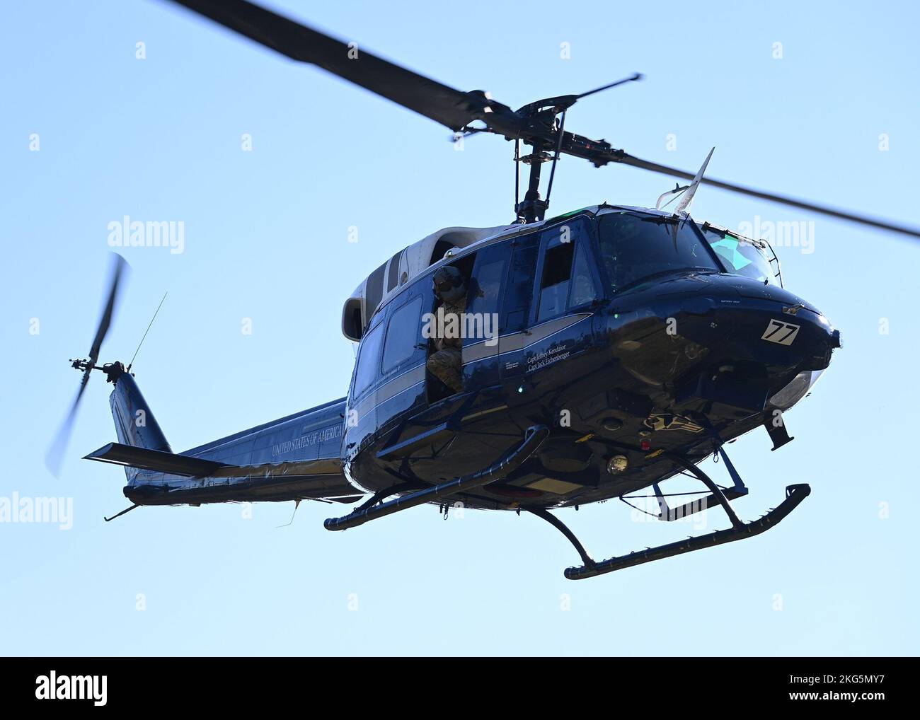 A 1st Helicopter Squadron Airman looks out of a UH-1N Huey at Joint ...