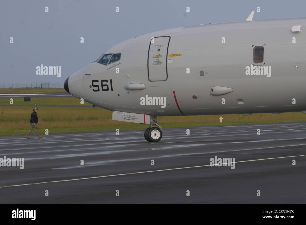A U.S. Navy Sailor marshals a P-8A Poseidon at Lajes Field, Portugal ...