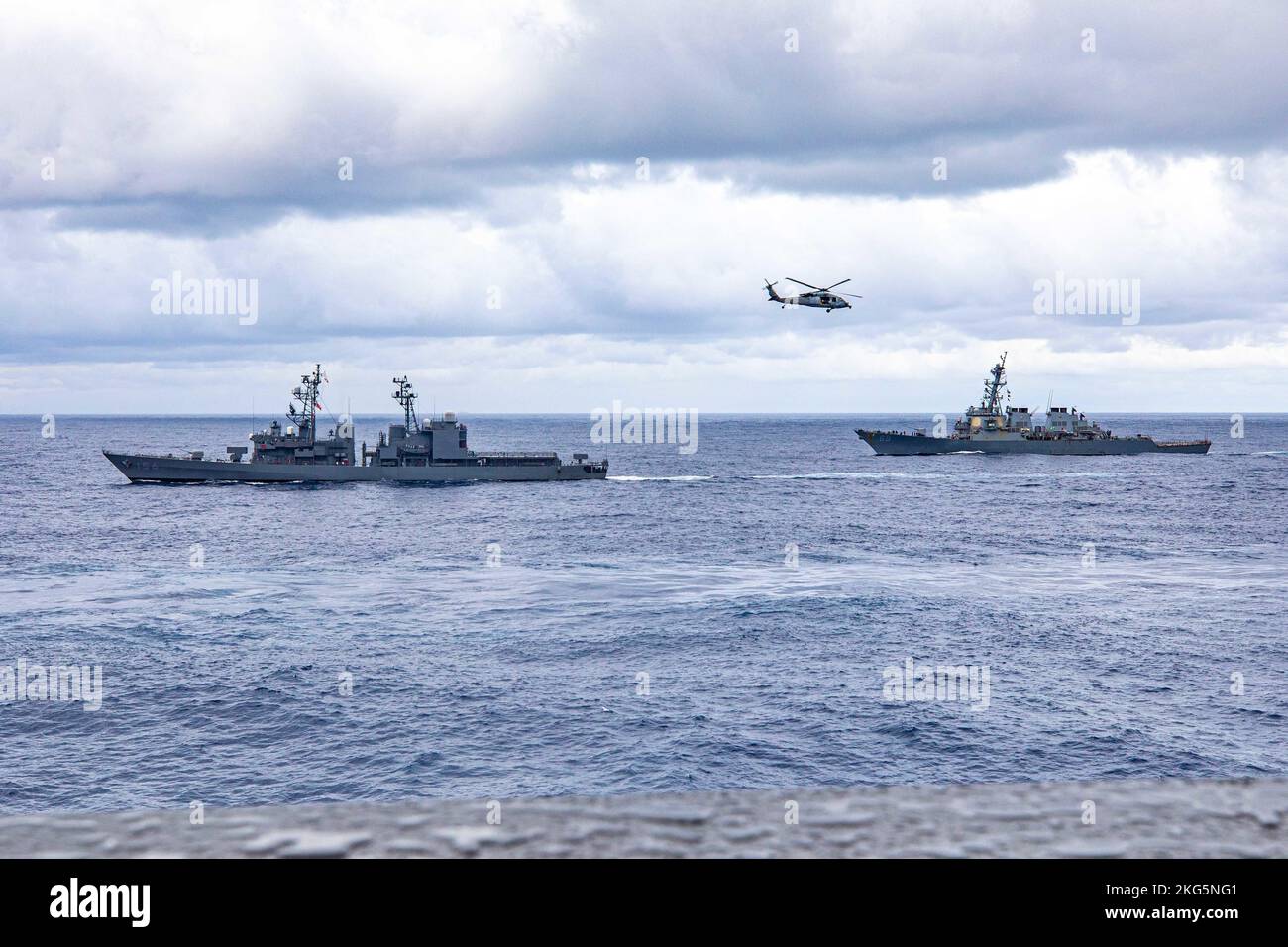PHILIPPINE SEA (Nov. 20, 2022) USS Chancellorsville (CG 62) along with ...