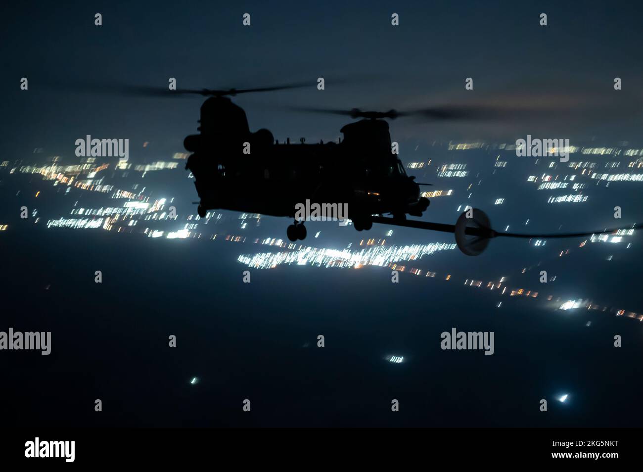 U.S. Army CH-47 Chinook aircrew perform helicopter aerial refueling ...