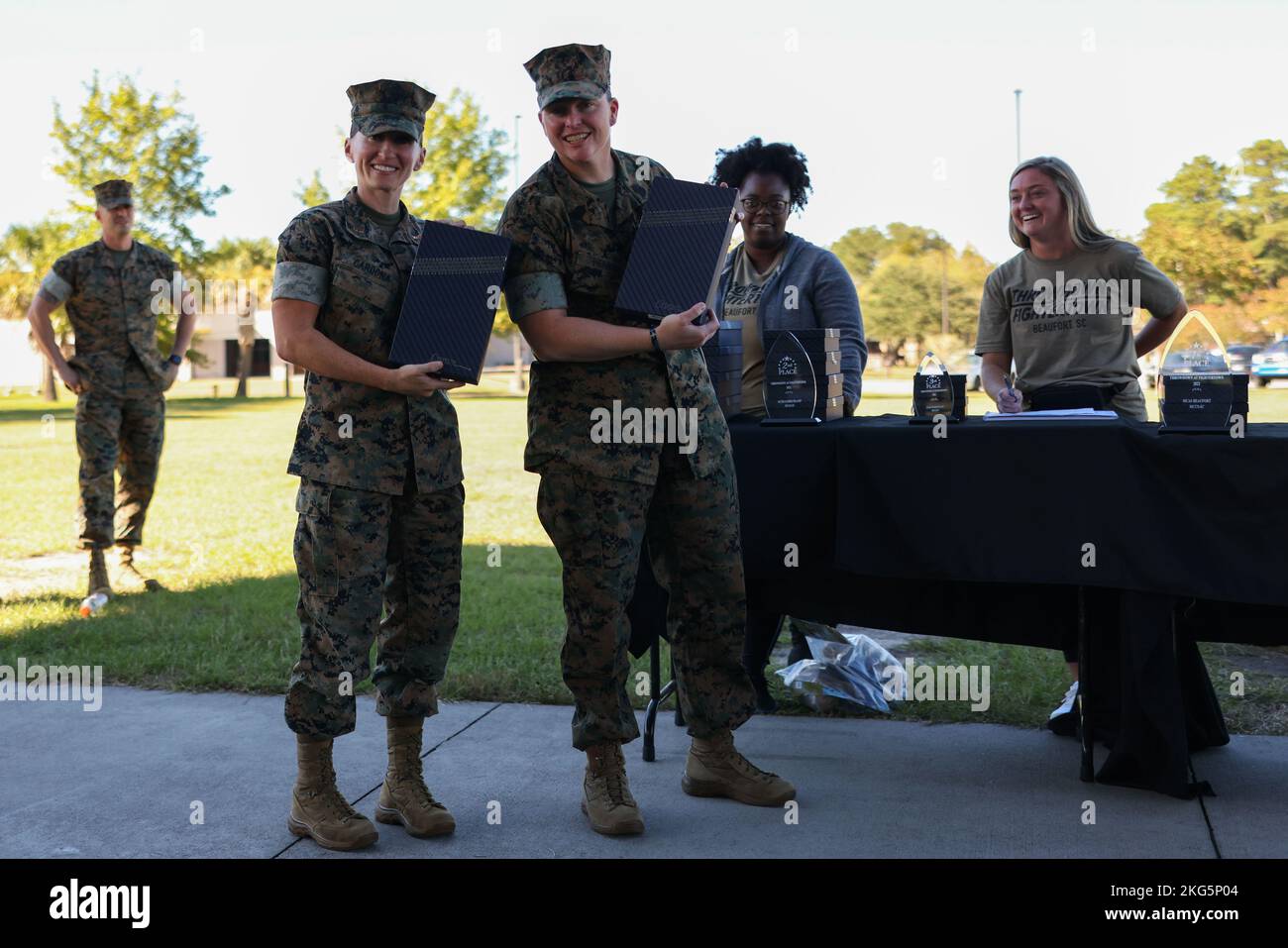 U.S. Marine Corps Chief Warrant Officer 2 Stevie Cardona, left ...