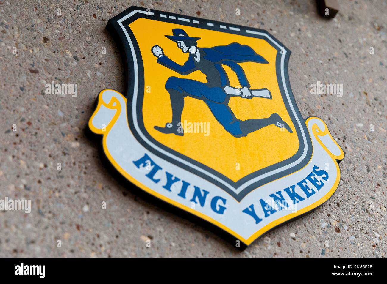 A sign depicting the insignia of the 103rd Airlift Wing is displayed on ...