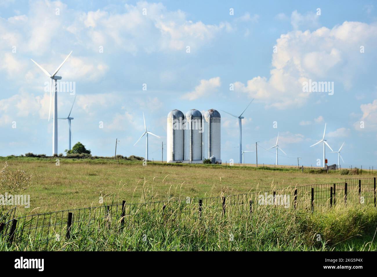 Wind turbines and grain silos share pastureland on Buffalo Ridge in ...