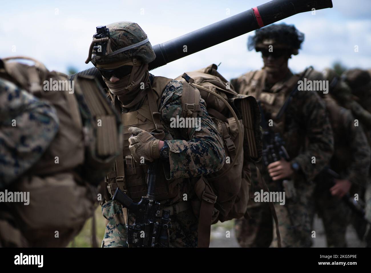 U.S. Marines with 3d Battalion, 3d Marines, 3d Marine Division, load a ...