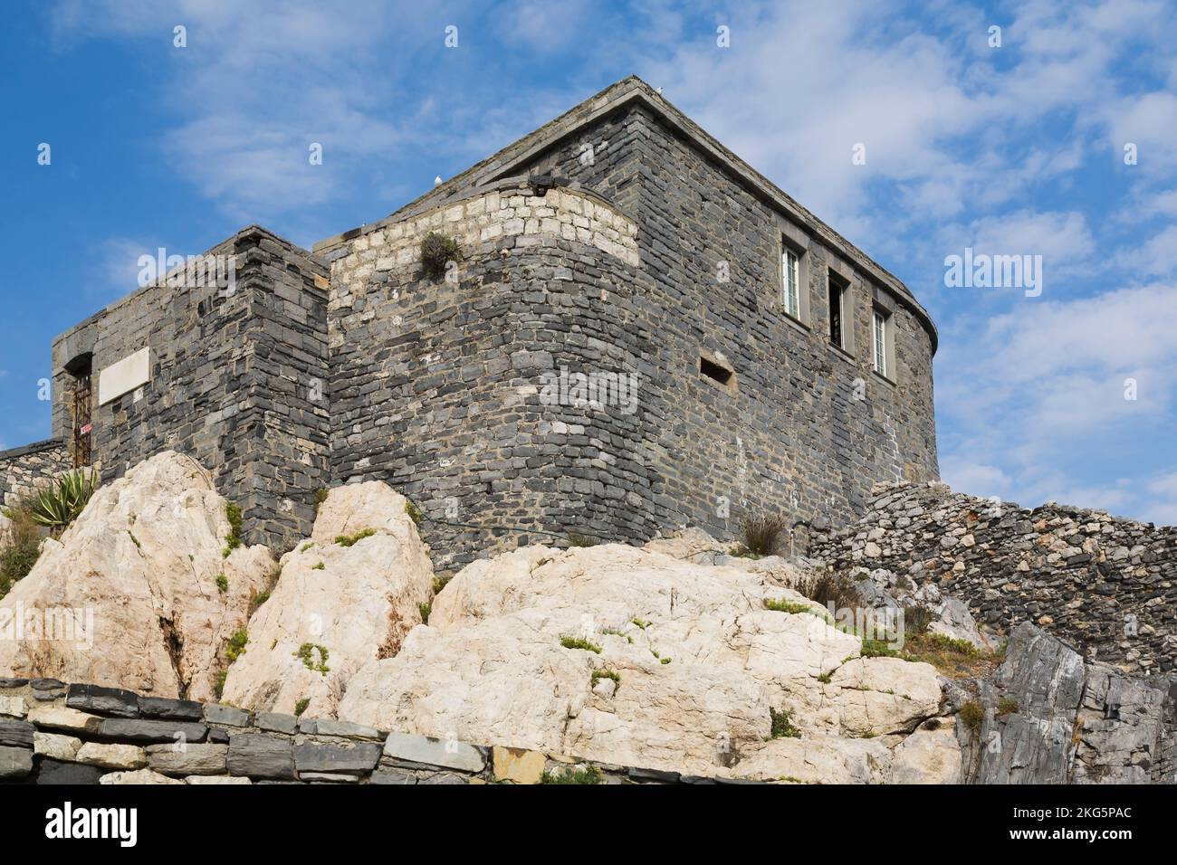 Old stone wall and building at medieval fortress ruins in Portovenere ...